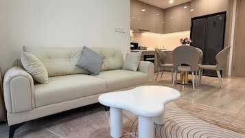 Apartamento Superior, vista para o jardim | Sala de estar