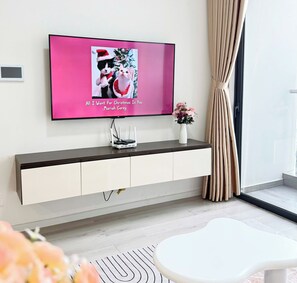 Apartamento superior, vista para o jardim | Área de estar