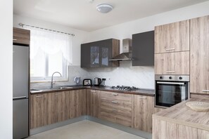 Apartamento, vista para o jardim | Cozinha privada