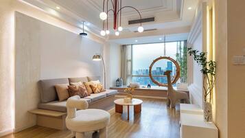 Suíte superluxo, vista para a cidade | Área de estar