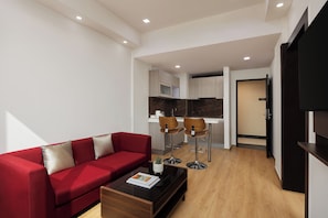 Suíte executiva, vista para a cidade | Área de estar