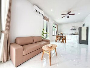 Quarto Deluxe, 1 cama king-size | Sala de estar