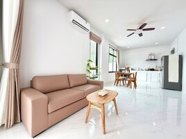 Quarto luxo, 1 cama King | Área de estar