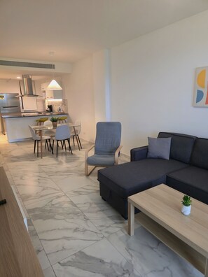 Apartamento Exclusivo | Sala de estar | Televisor LED de 55 polegadas com canais digitais, Netflix 