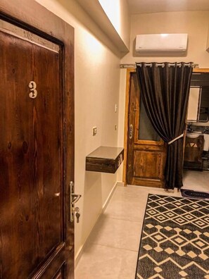 Quarto Individual Comfort, varanda, vista para o jardim | Interior