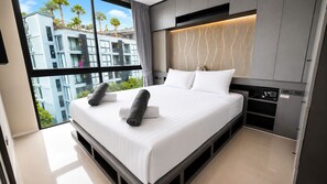 Apartamento Deluxe, 1 quarto (Chic n Cozy CityGate 1BR Suite) | Cofre no quarto, com mobília individualizada 