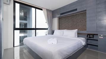 Apartamento, 1 quarto (Fabulous CityGate Kamala 1BR Suite) | Cofre no quarto, ferro/tábua de engomar, Wi-fi grátis