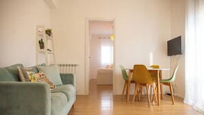 Apartamento, vista parcial para o mar | Área de estar