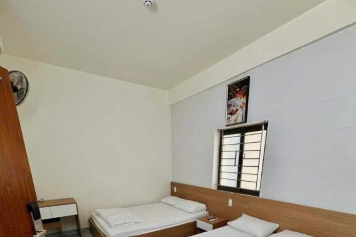 Quarto quádruplo | Frigobar, cortinas blackout, Wi-Fi de cortesia, roupa de cama