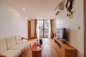 Quarto Executivo | Minibar, cofre no quarto, cortinas/cortinados opacos 