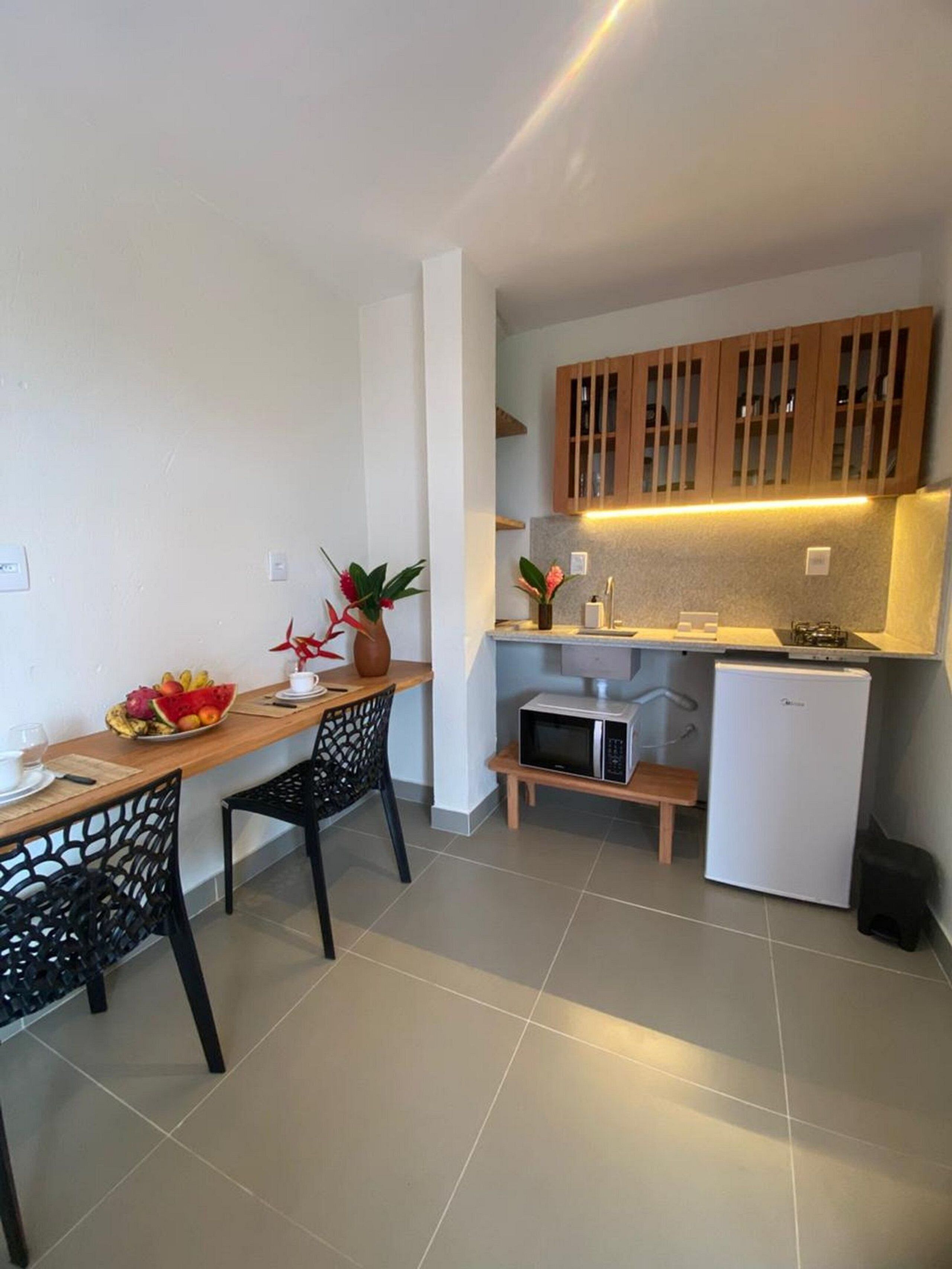 Apartamento | Cozinha privada | Frigobar, fogão, talheres/pratos/utensílios de cozinha