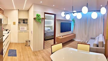 Apartamento | Área de estar | Smart TV 42 polegadas com canais de TV premium