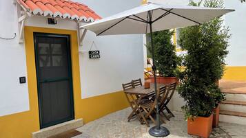 Casa, 1 cama queen-size, pátio | Refeições ao ar livre