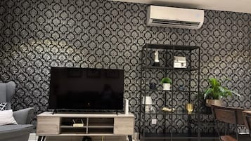 Apartamento luxo, vista para a cidade | Área de estar