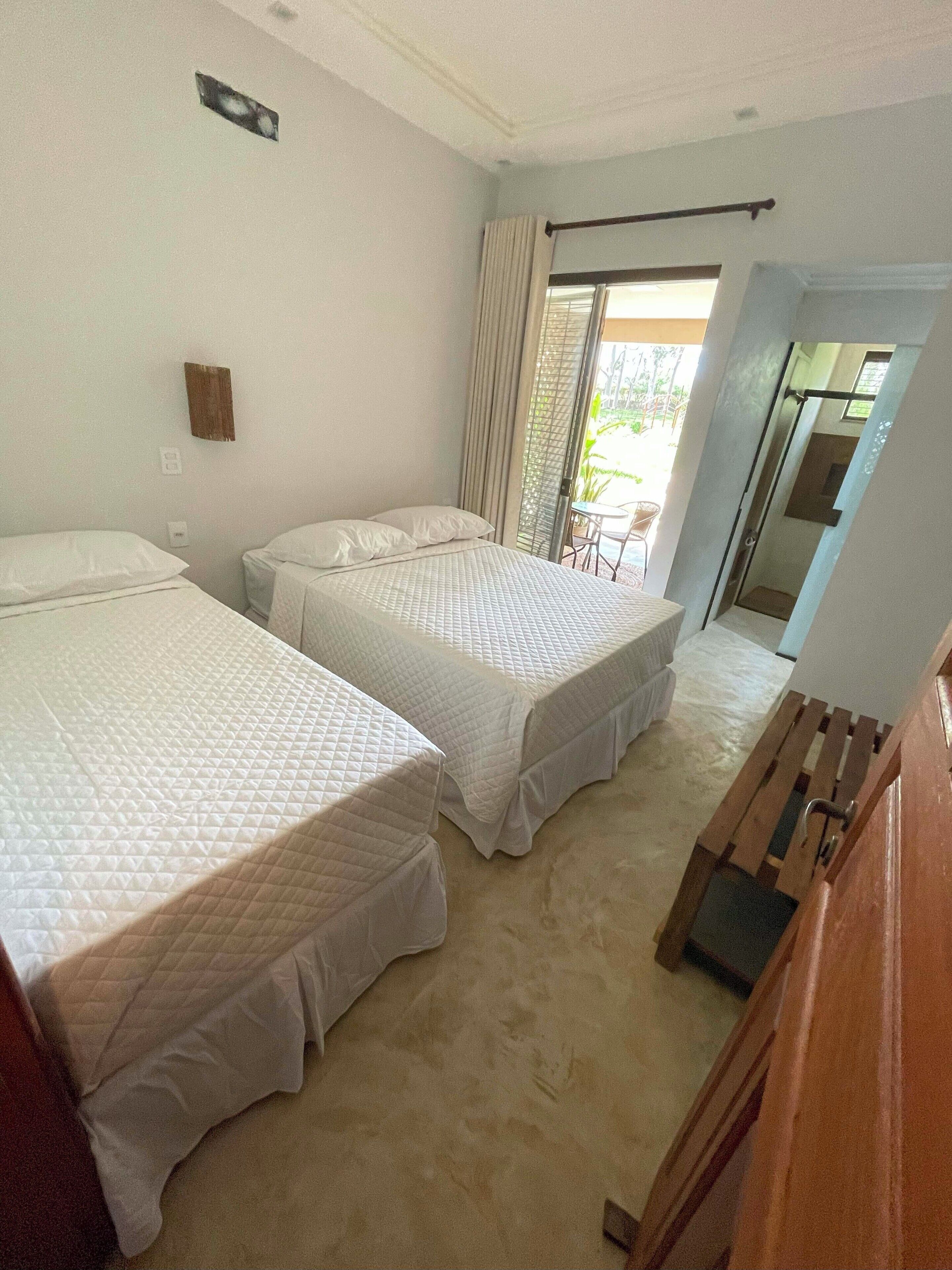 Quarto triplo, vista para o jardim | Wi-Fi de cortesia