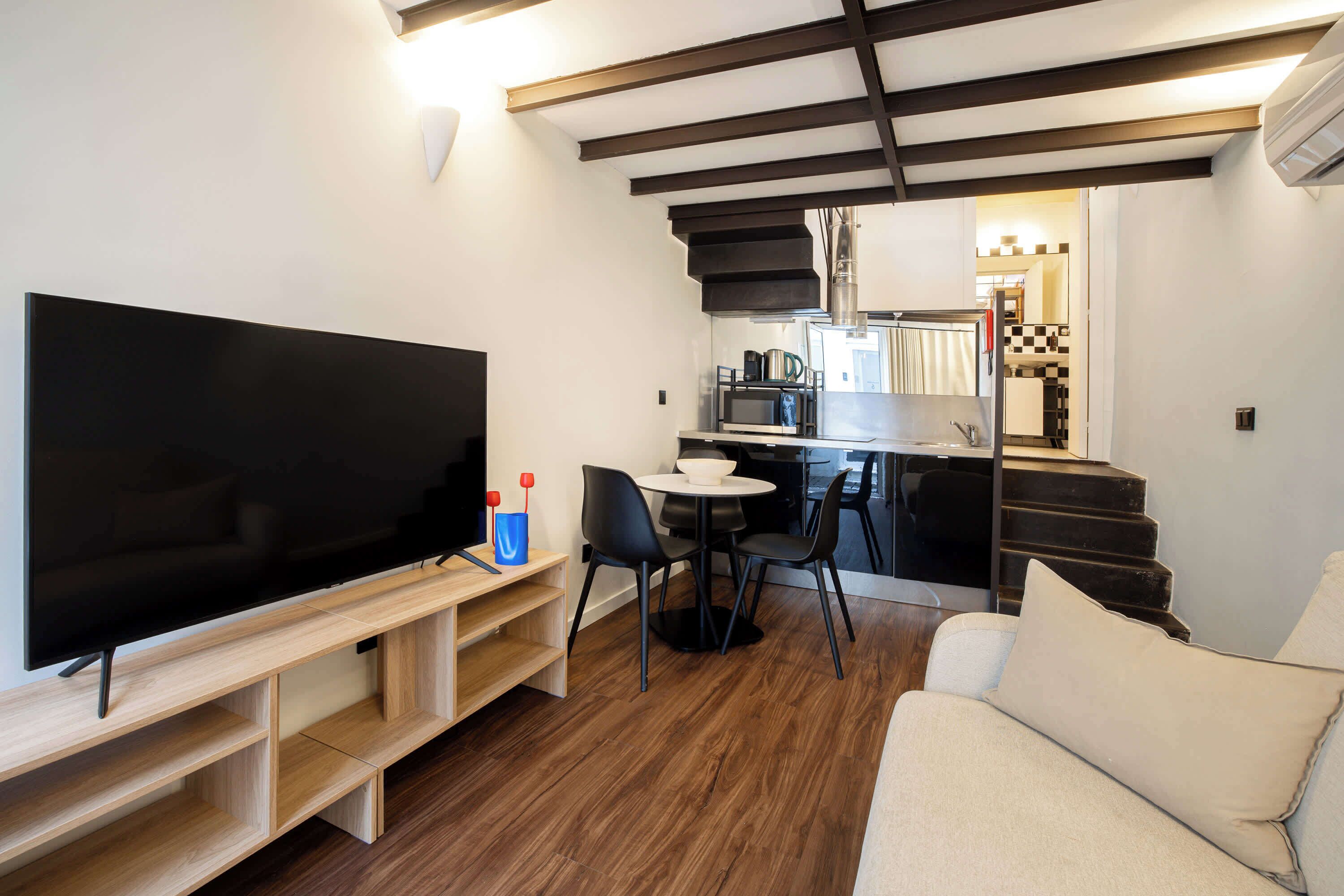 Apartamento | Sala de estar | Televisor de 60 cm com canais por cabo 