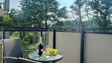 Apartamento Comfort, varanda | Refeições ao ar livre