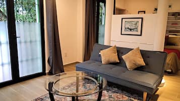 Suíte luxo, vista para a cidade | Área de estar