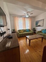 Apartamento Superior, vista para o jardim | Sala de estar