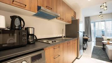 Apartamento, varanda | Cozinha privada