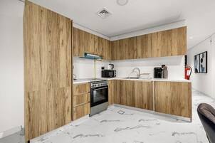 Apartamento, varanda | Cozinha privada