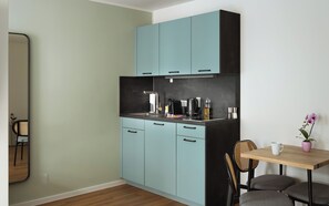 Suíte, 1 cama Queen e sofá-cama | Cozinha privada | Geladeira, cooktop, máquina de café expresso, chaleira elétrica