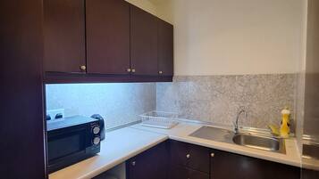 Apartamento, Vista para a cidade | Cozinha privada