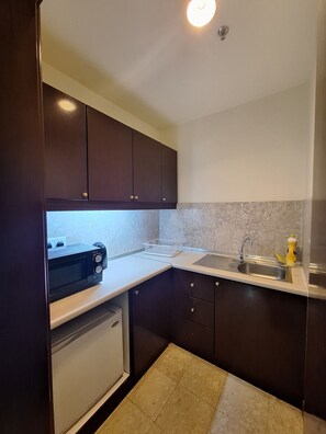 Apartamento, Vista para a cidade | Cozinha privada