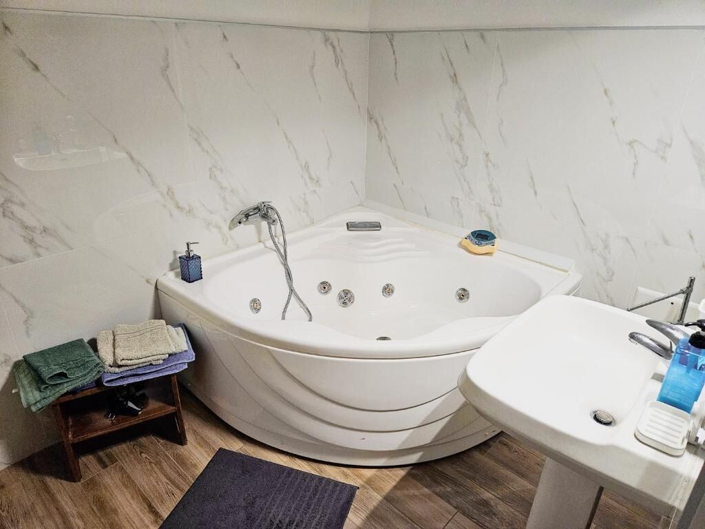 Quarto Deluxe | Banheira de hidromassagem privativa