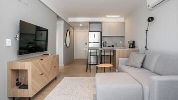 Apartamento galeria | Sala de estar | Smart TV 40 polegadas com canais digitais