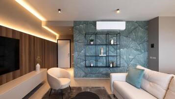 Apartamento Premium, 2 quartos, varanda | Sala de estar | Televisor plasma de 65 polegadas com canais via satélite, piso aquecido