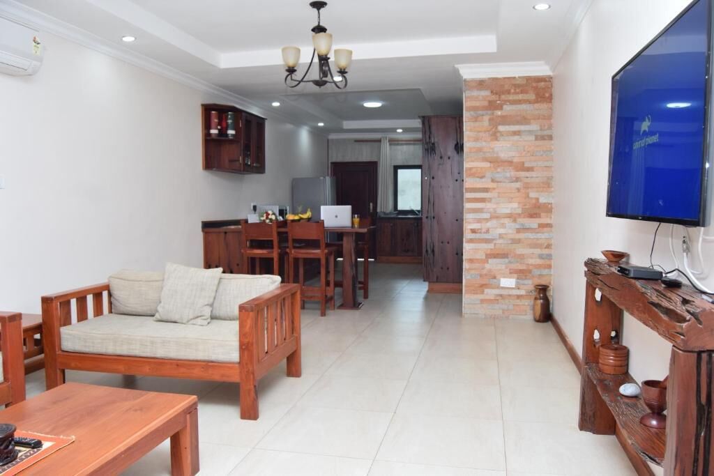 Apartamento luxo, 2 quartos, varanda | Área de estar | TV de tela plana