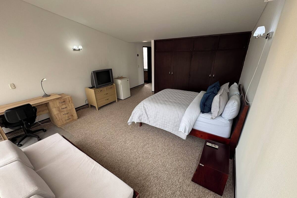 Quarto casal júnior, vista para o jardim