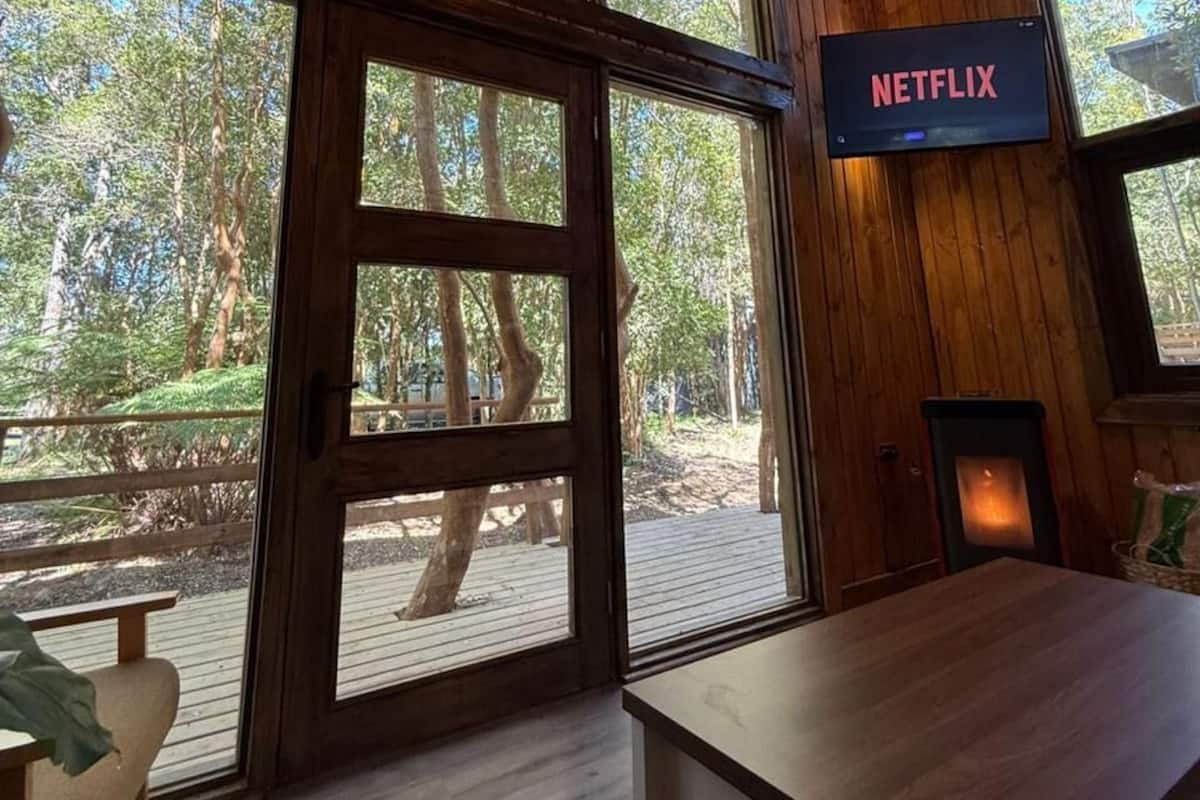 Quarto família, vista para o jardim | Área de estar