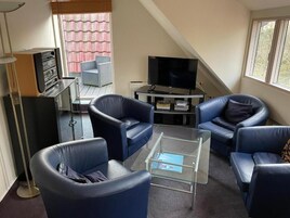 Apartamento, 1 quarto, vista para o oceano | Área de estar