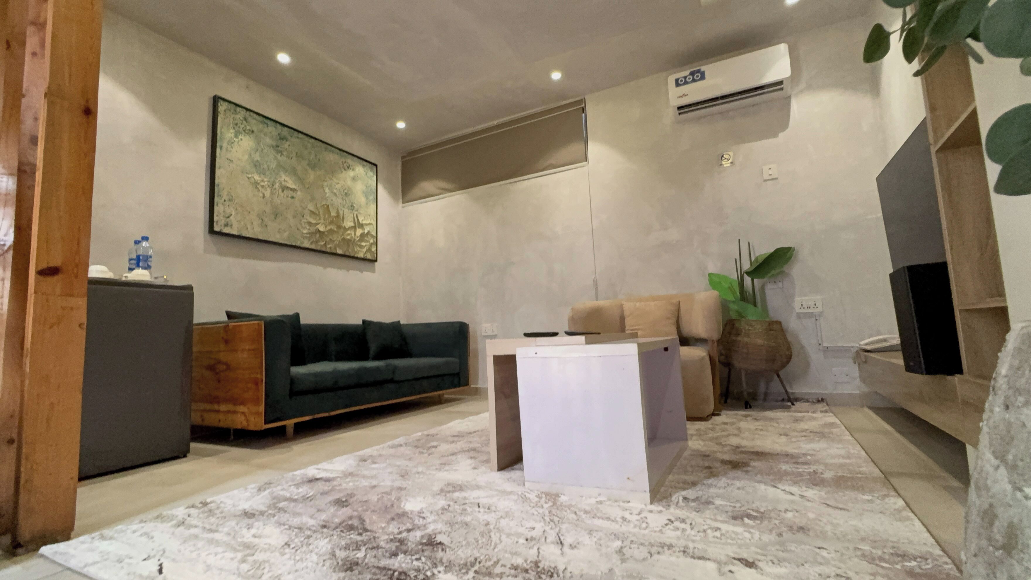 Apartamento Comfort, vista para a praia | Sala de estar | Smart TV 