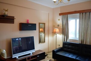 Apartamento, 2 quartos, sacada | Área de estar