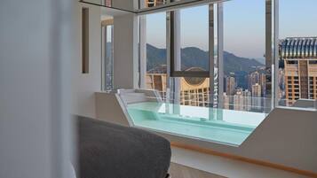 Suíte luxo, vista para a cidade | Parte interna