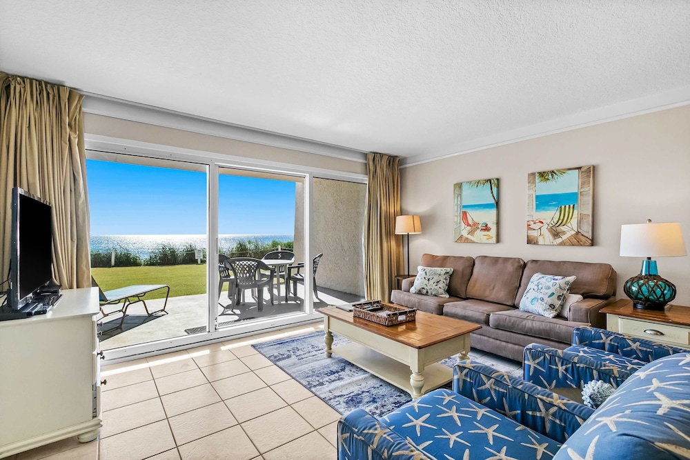 Gulf and beachfront condo with furnished patio, outdoor pool, gym ...