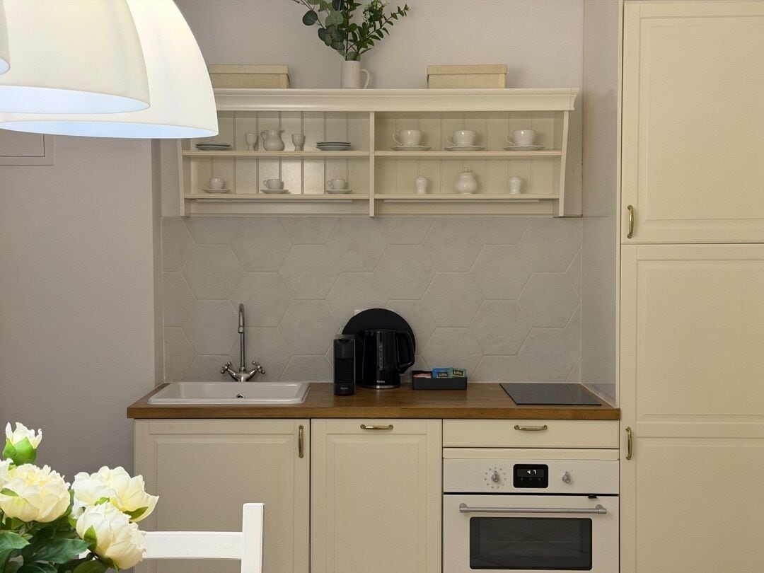 Apartamento luxo, 2 quartos | Cozinha americana privada | Geladeira, fogão, cooktop, lava-louças