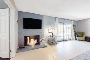 Sun-soaked oasis with a pool, covered patio, grill, modern interior, W ...