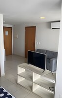 Apartamento conforto | Área de estar | TV