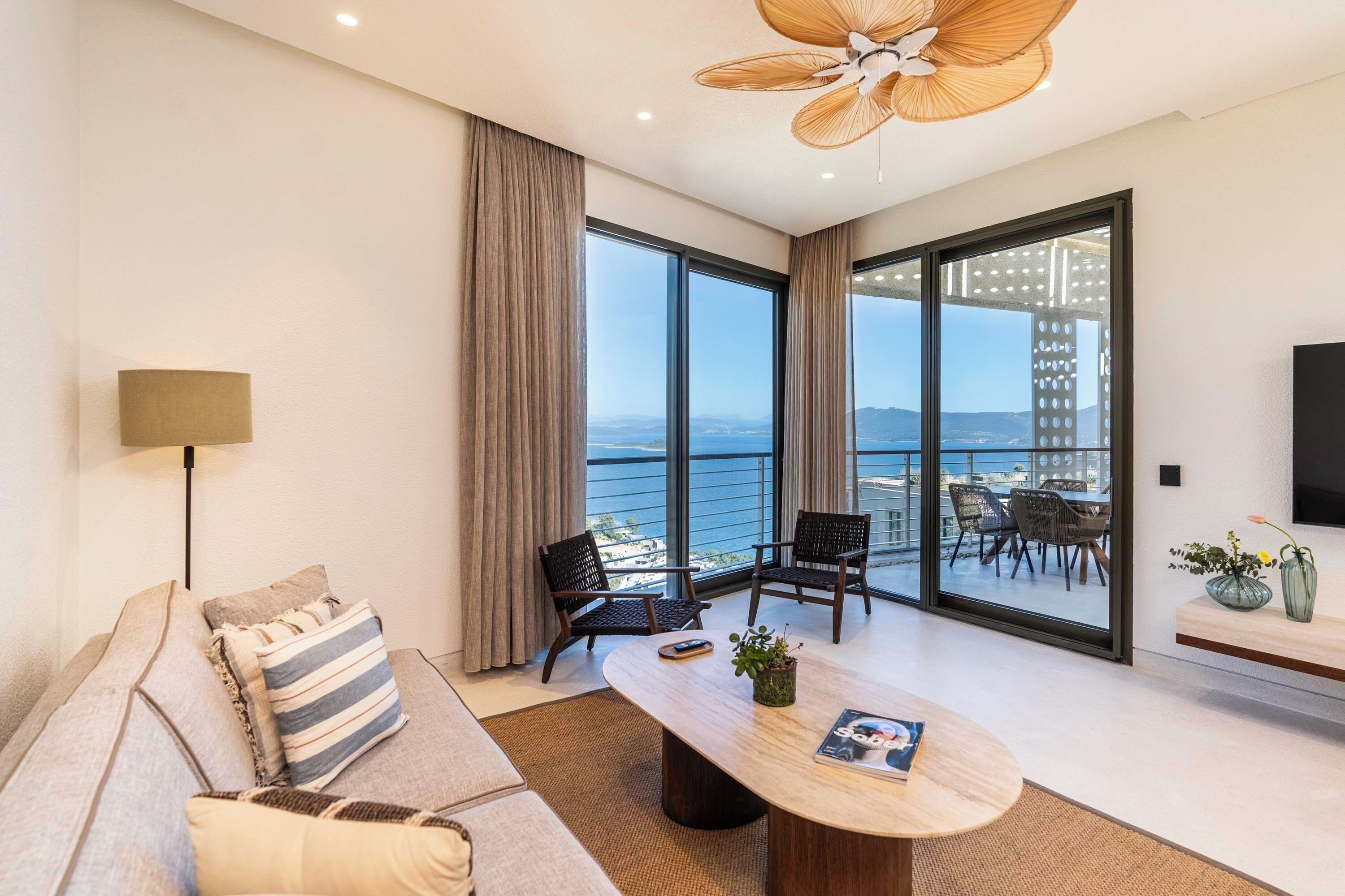 Quarto Quádruplo de Luxo, vista para o mar | Sala de estar