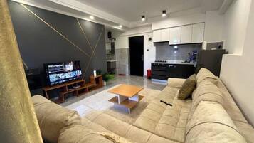 Quarto superluxo, sacada, vista para a cidade | Área de estar