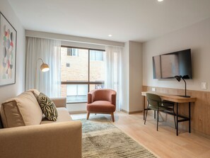 Apartamento Deluxe | Sala de estar