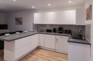 Apartamento, varanda | Cozinha privada