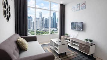 Apartamento família, 3 quartos, vista para a cidade | Área de estar