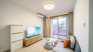 Suite Familiar, 1 cama queen-size, não fumadores, Vista para a cidade | Sala de estar