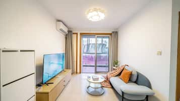 Suite Familiar, 1 cama queen-size, não fumadores, Vista para a cidade | Sala de estar