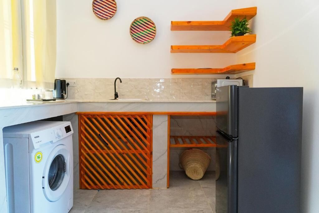 Suite Júnior, varanda, vista para o jardim | Cozinha privada